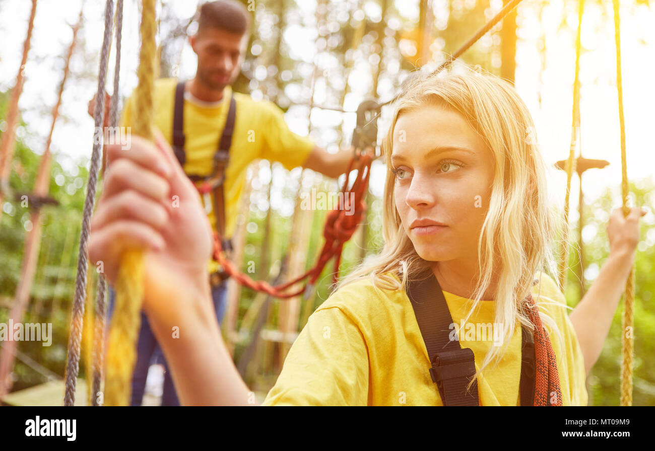 Woman climbing tree hi-res stock photography and images - Alamy
