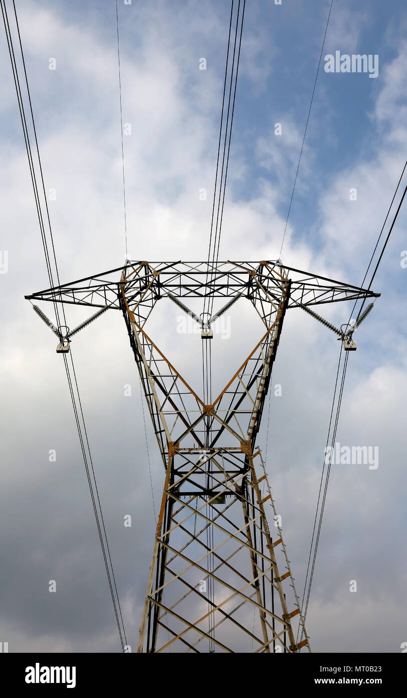 high voltage pylon with electric cables and blue sky Stock Photo - Alamy