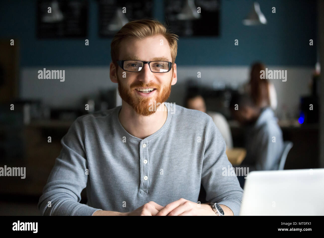Redhead man laptop looking camera hi-res stock photography and images ...