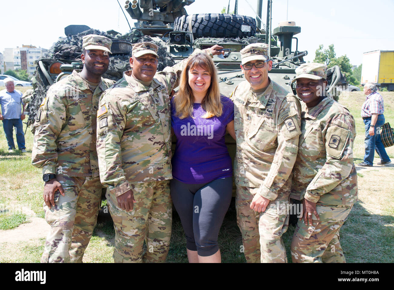 Soldiers of 361st Civil Affairs Brigade pose for a photo with locals of ...