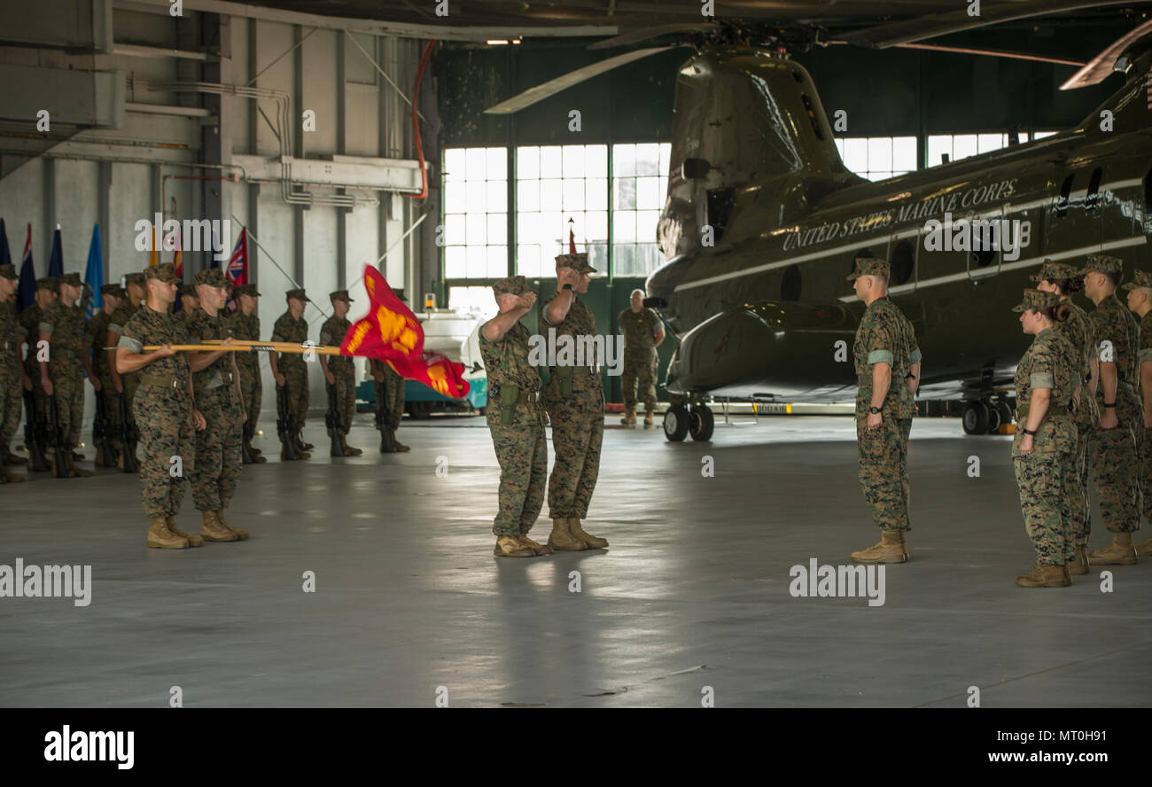 U.S. Marines with Marine Corps Air Facility (MCAF) salute during a ...