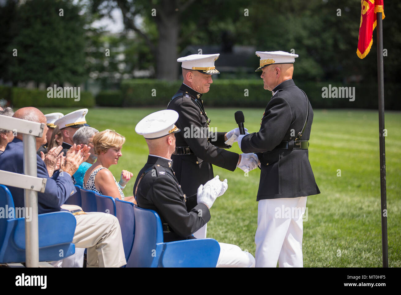U.S. Marine Corps Gen. Robert B. Neller, right, shakes the hand of Lt ...