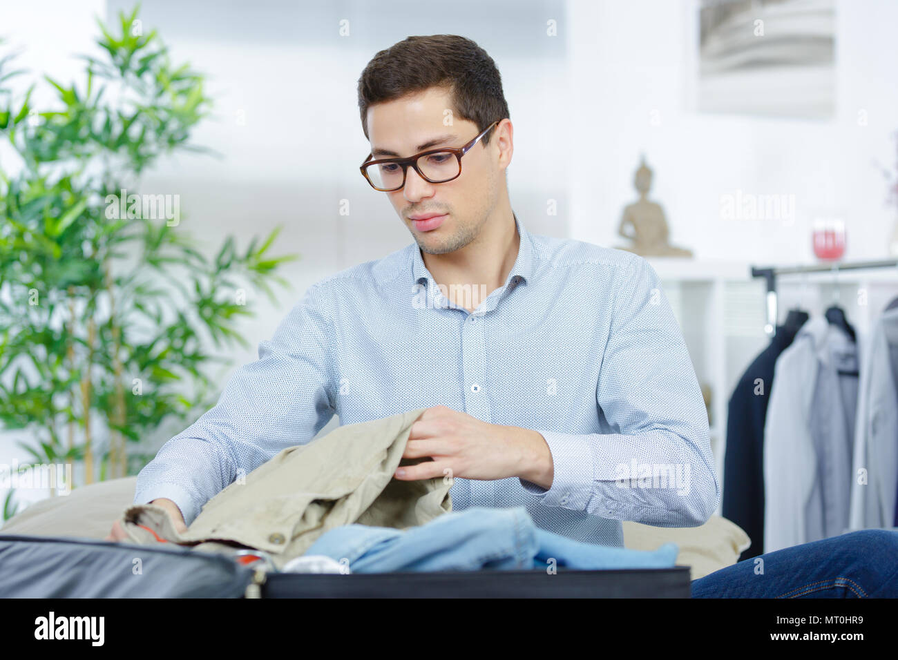 Professional packing suitcase hi-res stock photography and images - Alamy
