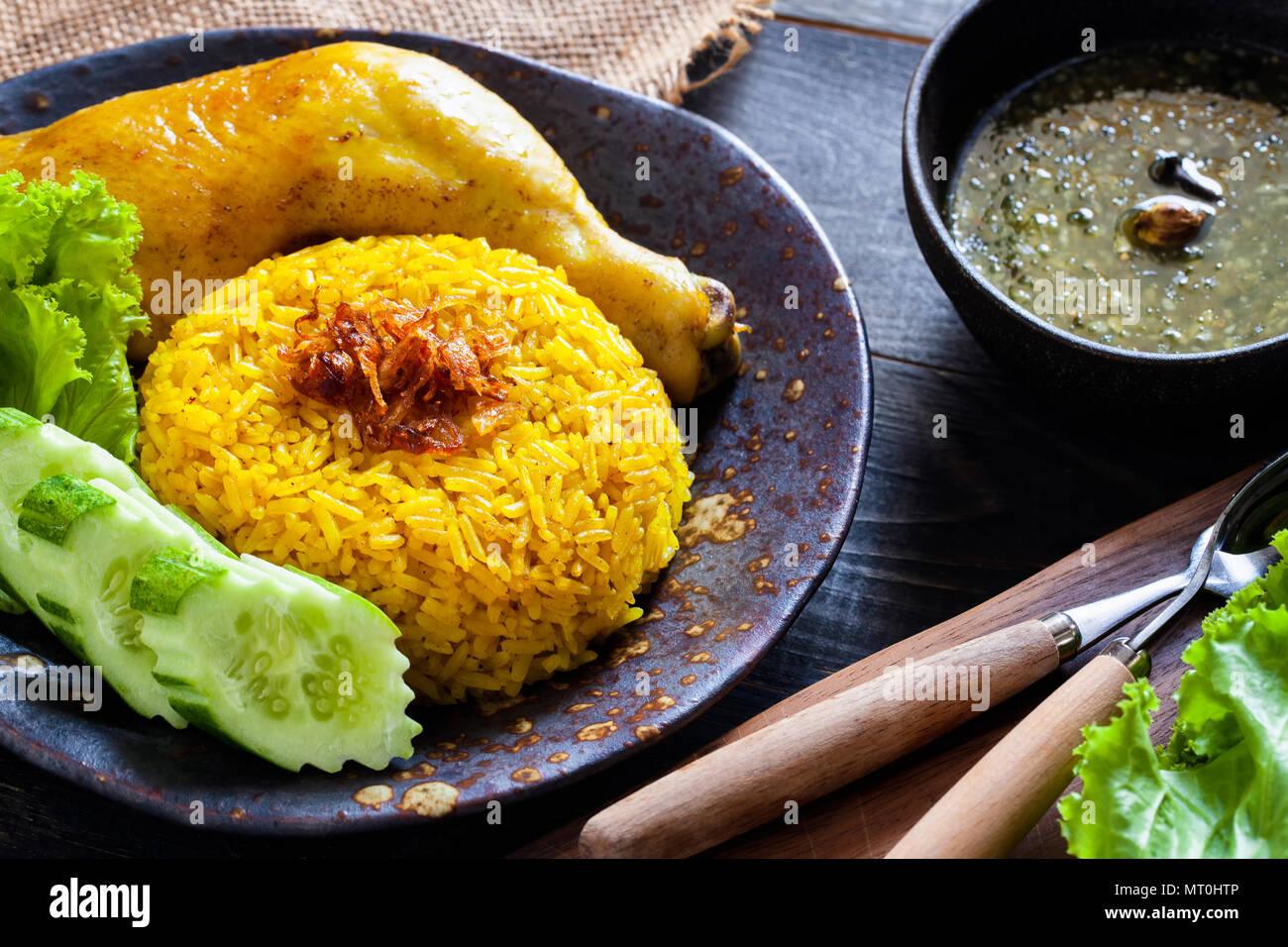 yellow rice with chicken or chicken biryani with rice Stock Photo - Alamy