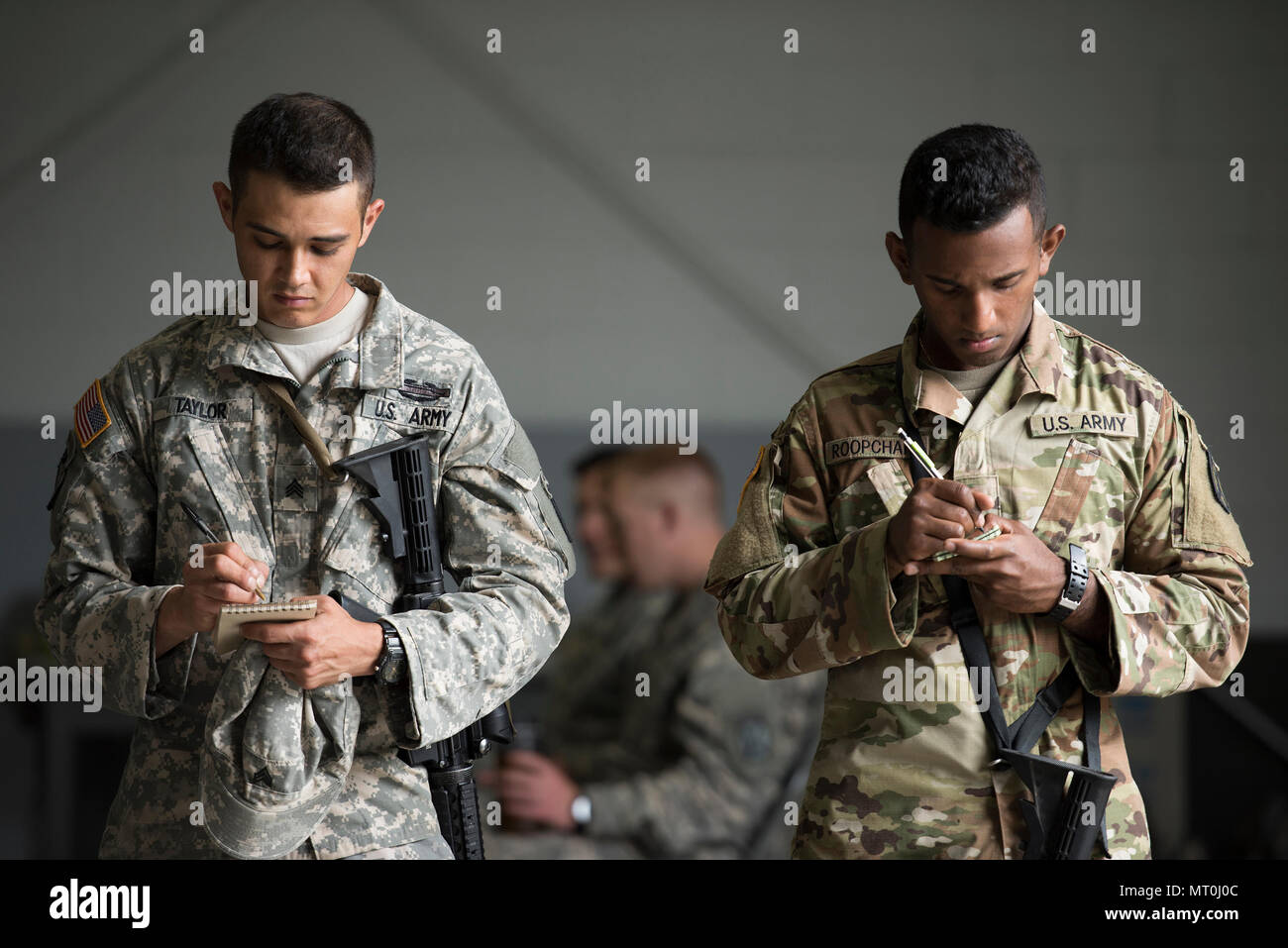 U.S. Army Sgt. Michael Taylor and Pfc. Jonathan Roopchand, both ...