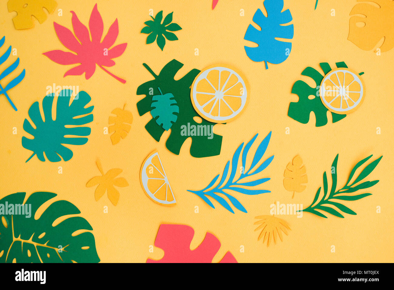 Tropical leaves and fruits pattern on a bright yellow background. Sunny ...