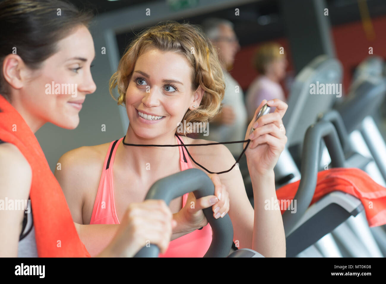 female coach is training a woman in a gym Stock Photo - Alamy