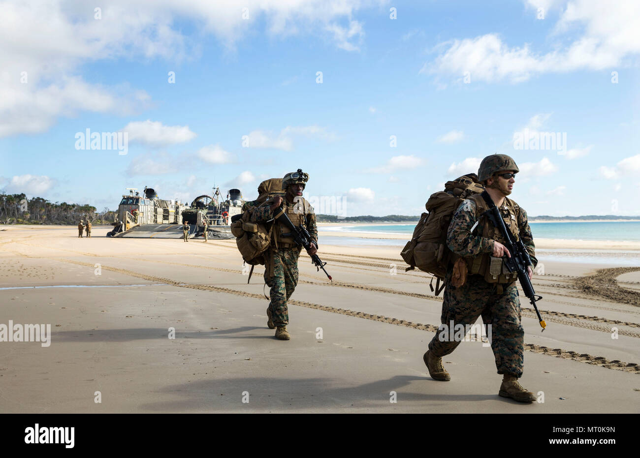 United States marines patrol up the beach at Shoalwater Bay Training ...
