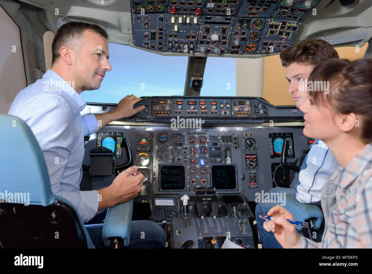 People in aircraft cockpit Stock Photo - Alamy
