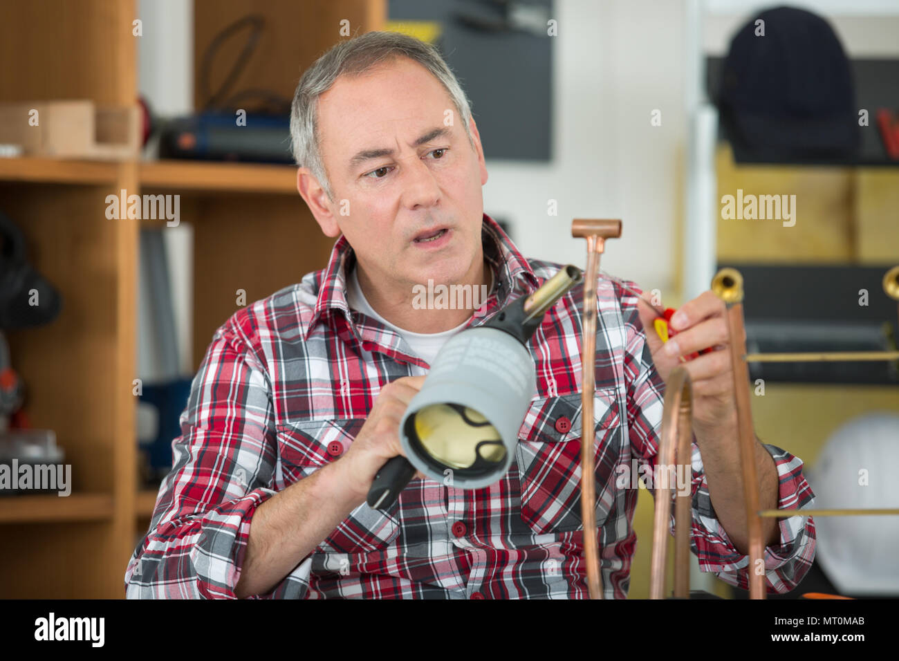 worker using a blowtorch Stock Photo - Alamy