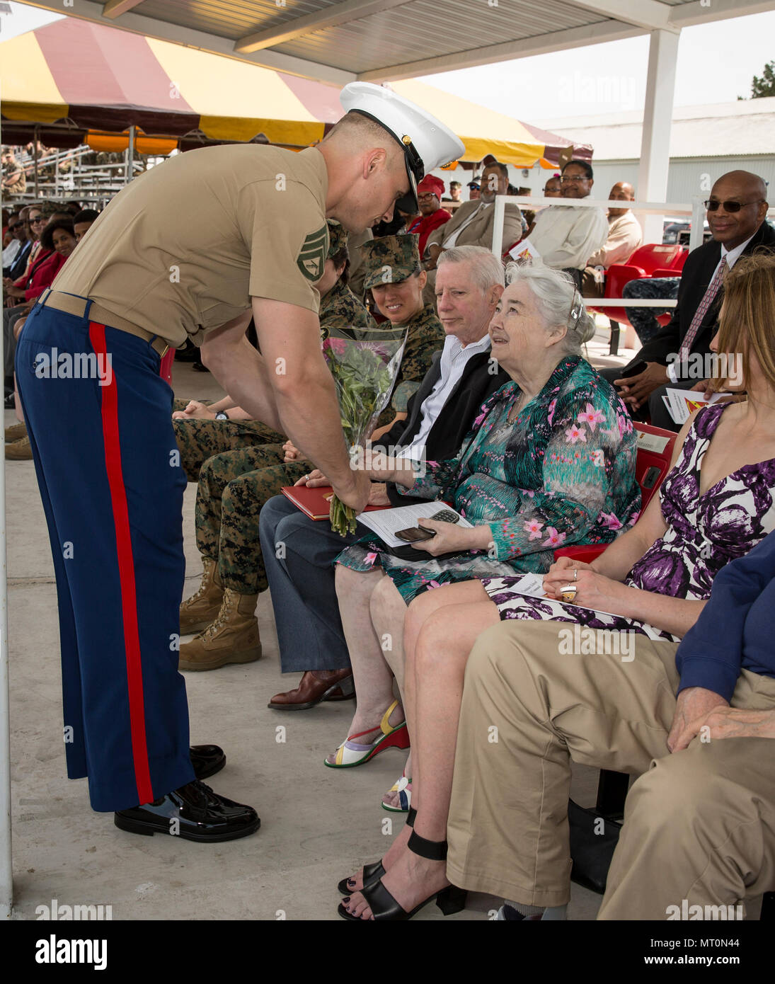 Flowers are presented to the mother of U.S. Marine Corps Col. Julie L ...
