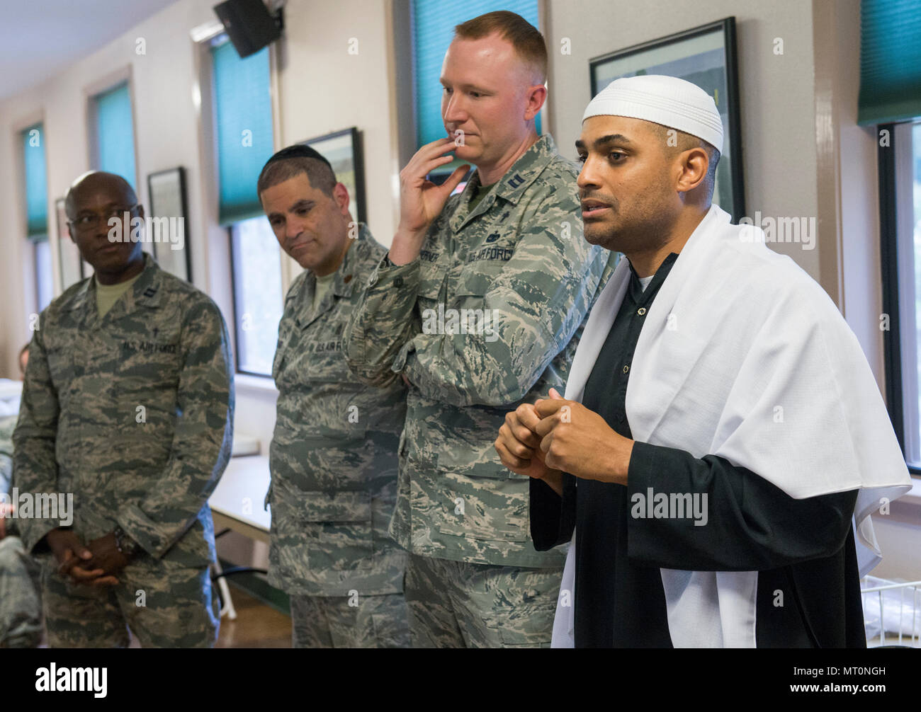 (From the right) Chaplains (Capt.) Rafael Lantigua, Islamic imam; (Capt ...