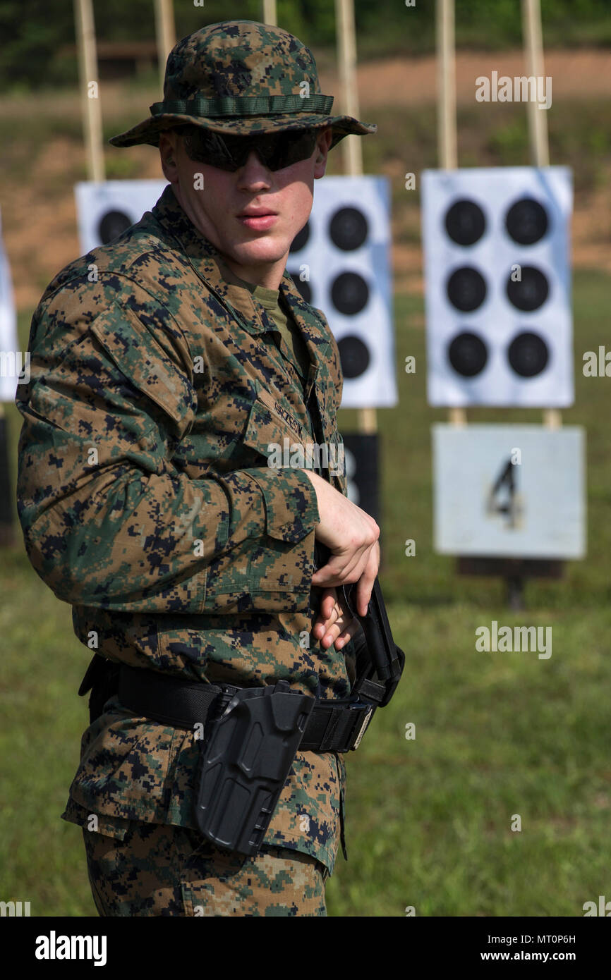 A U.S. Marine with Marine Corps Embassy Security Group (MCESG) holds ...