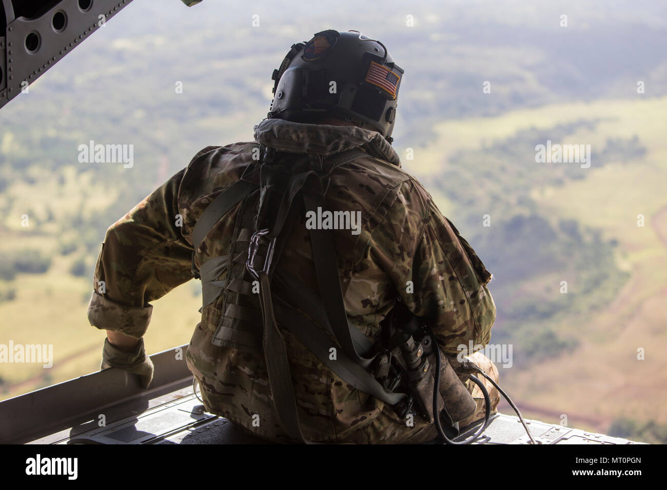 SCHOFIELD BARRACKS – A U.S. Army crew chief observes the outside of a ...