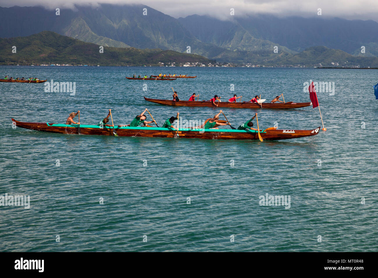 Paddlers race to the finish line during the “Na Koa Lani” canoe race ...