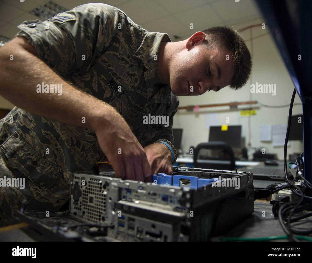 U.S. Air Force Senior Airman Andrew Montz, a cyber transport technician ...