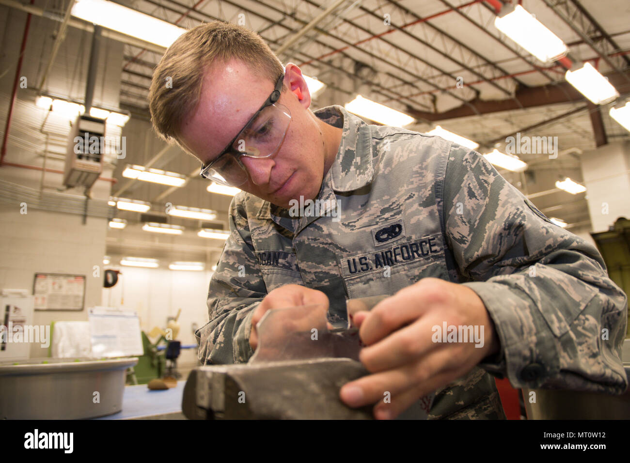 U.S. Air Force Senior Airman Preston Hogan, an aircraft structural ...