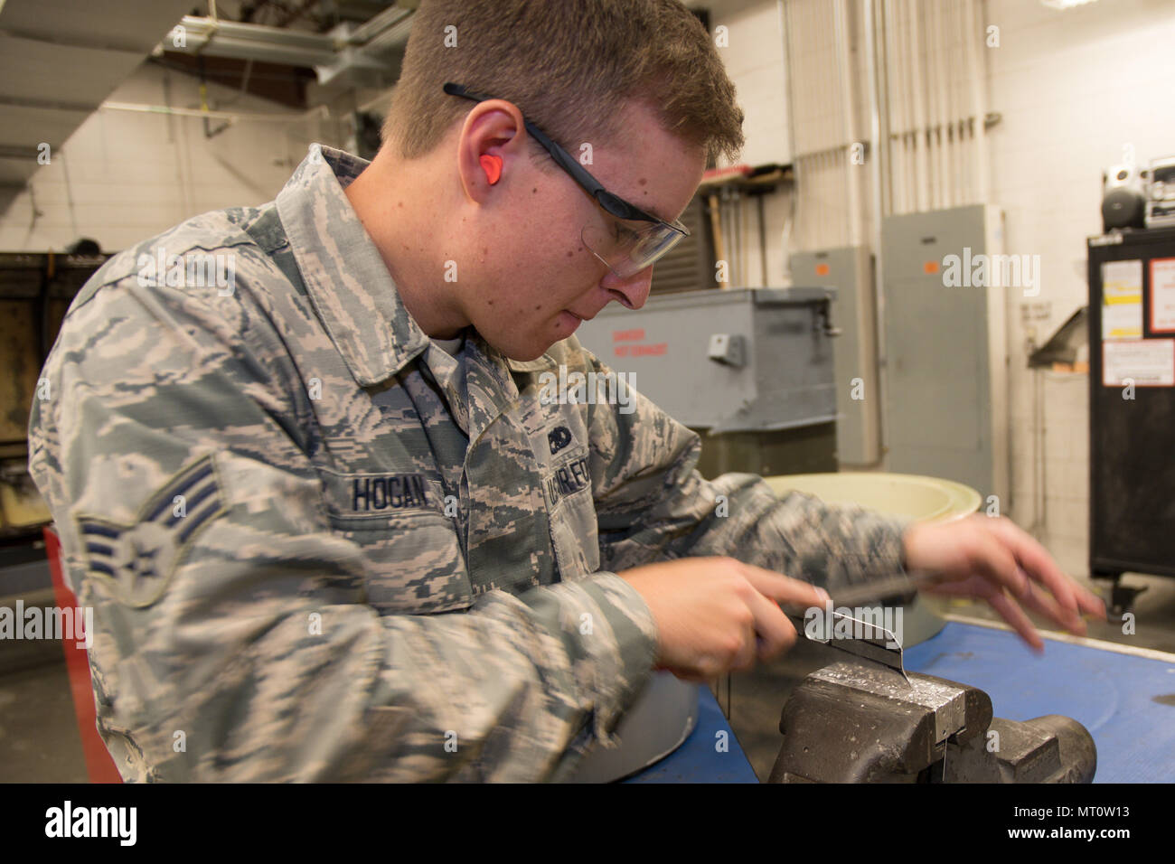 U.S. Air Force Senior Airman Preston Hogan, an aircraft structural ...