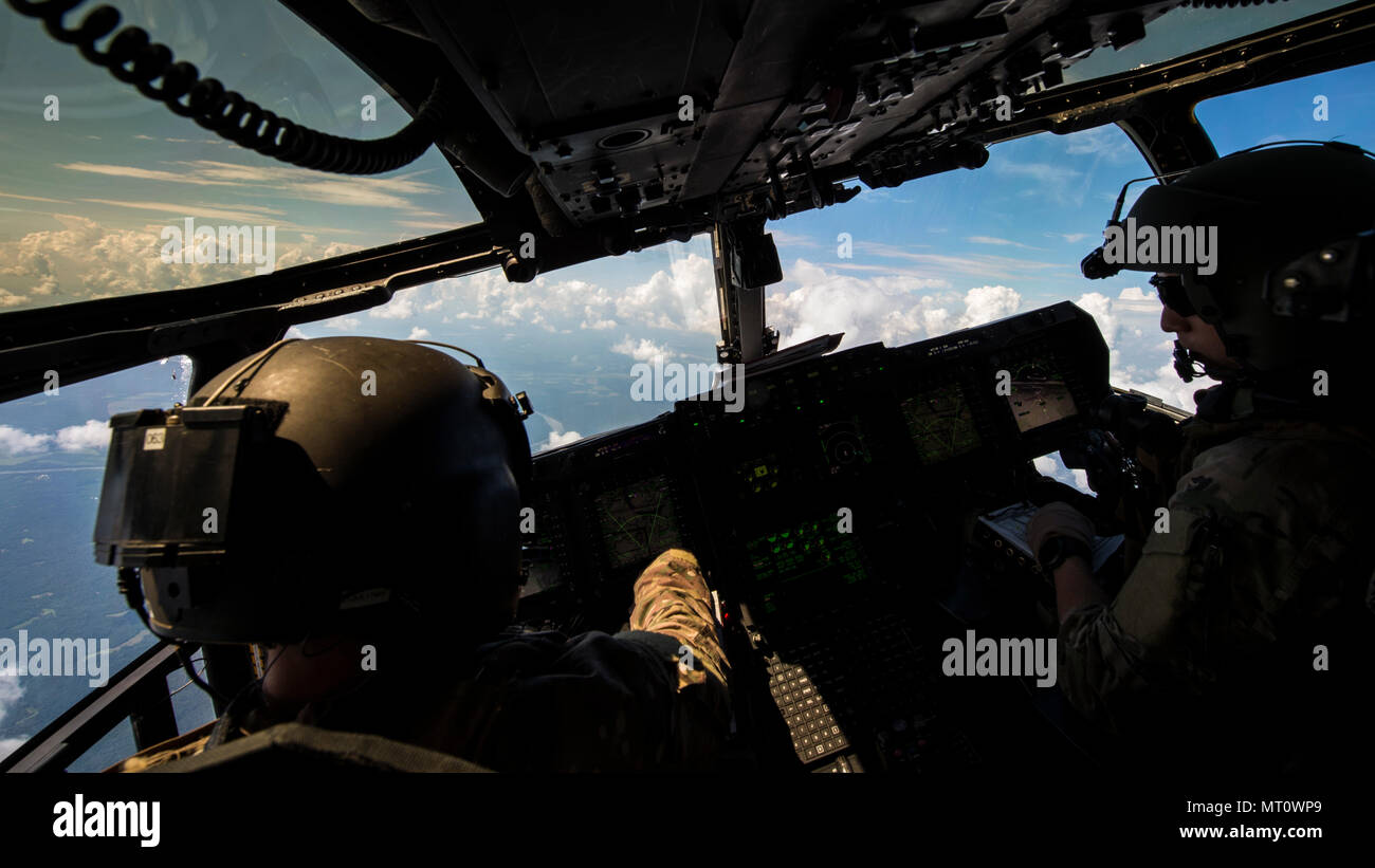 Aircrew with the 8th Special Operations Squadron pilot a CV-22 Osprey ...
