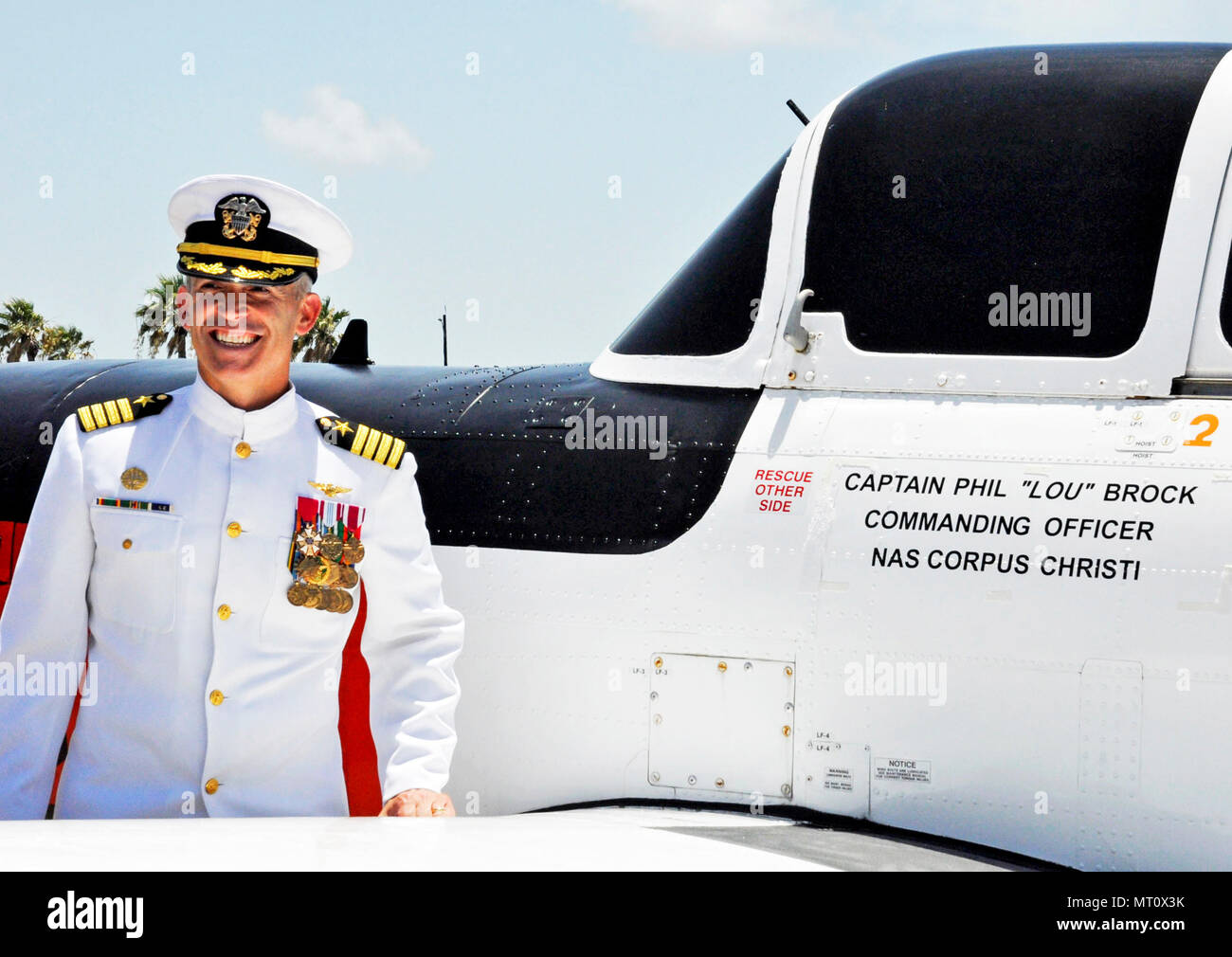 Capt. Philip Brock, stands next to the T-34C aircraft , July 20, that ...