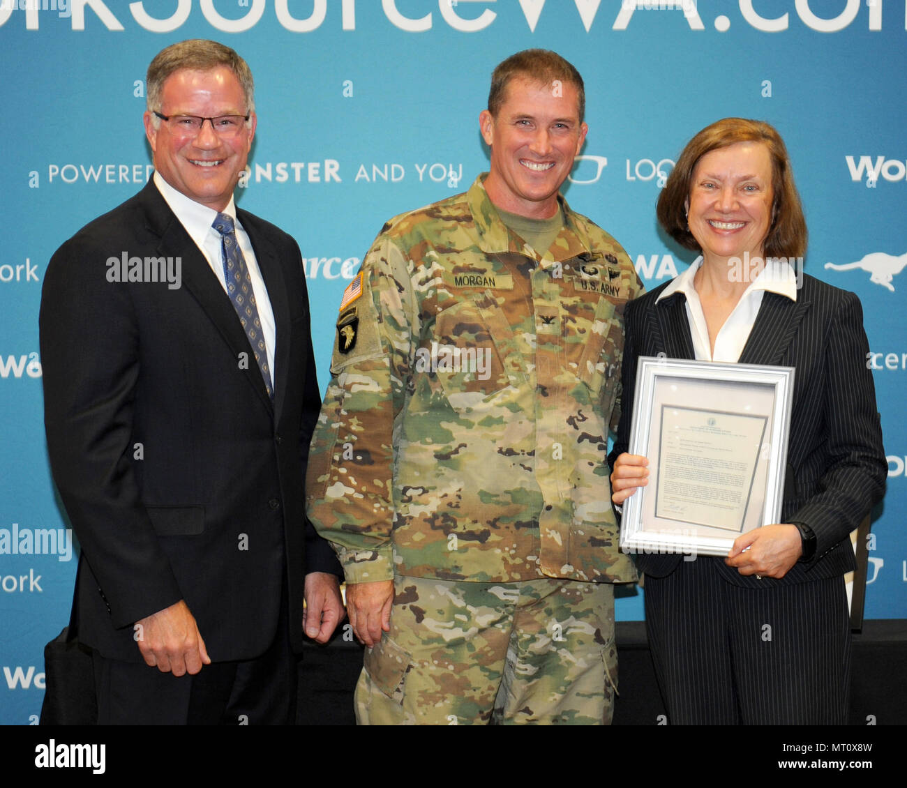 Col. Dan Morgan, Joint Base Lewis-McChord Garrison Commander, accepts ...