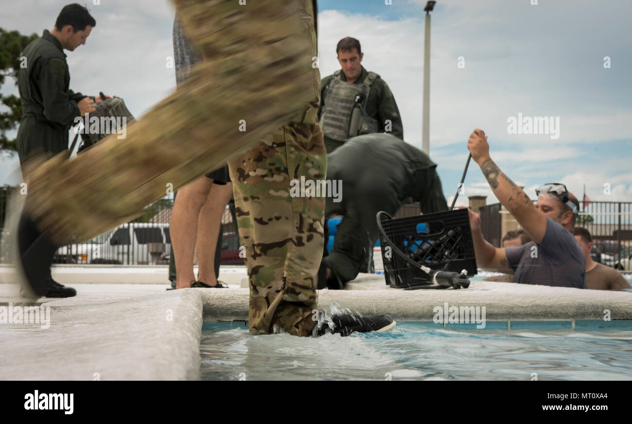 An 8th Special Operations Squadron aircrew member enters the base pool ...