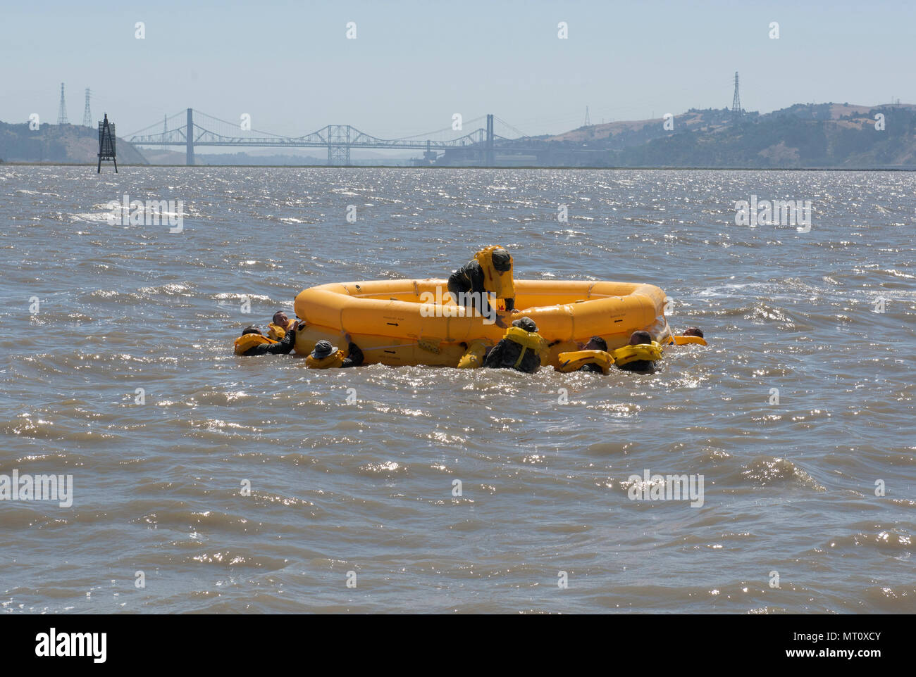 Aircrew members from Travis Air Force Base, Calif., help each other ...