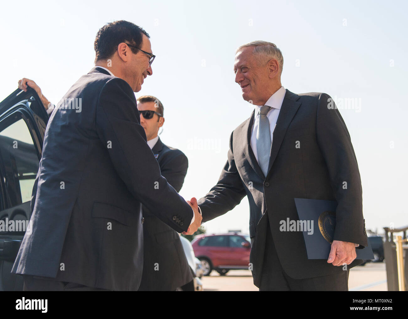 Defense Secretary Jim Mattis greets Secretary of Treasury Steven ...