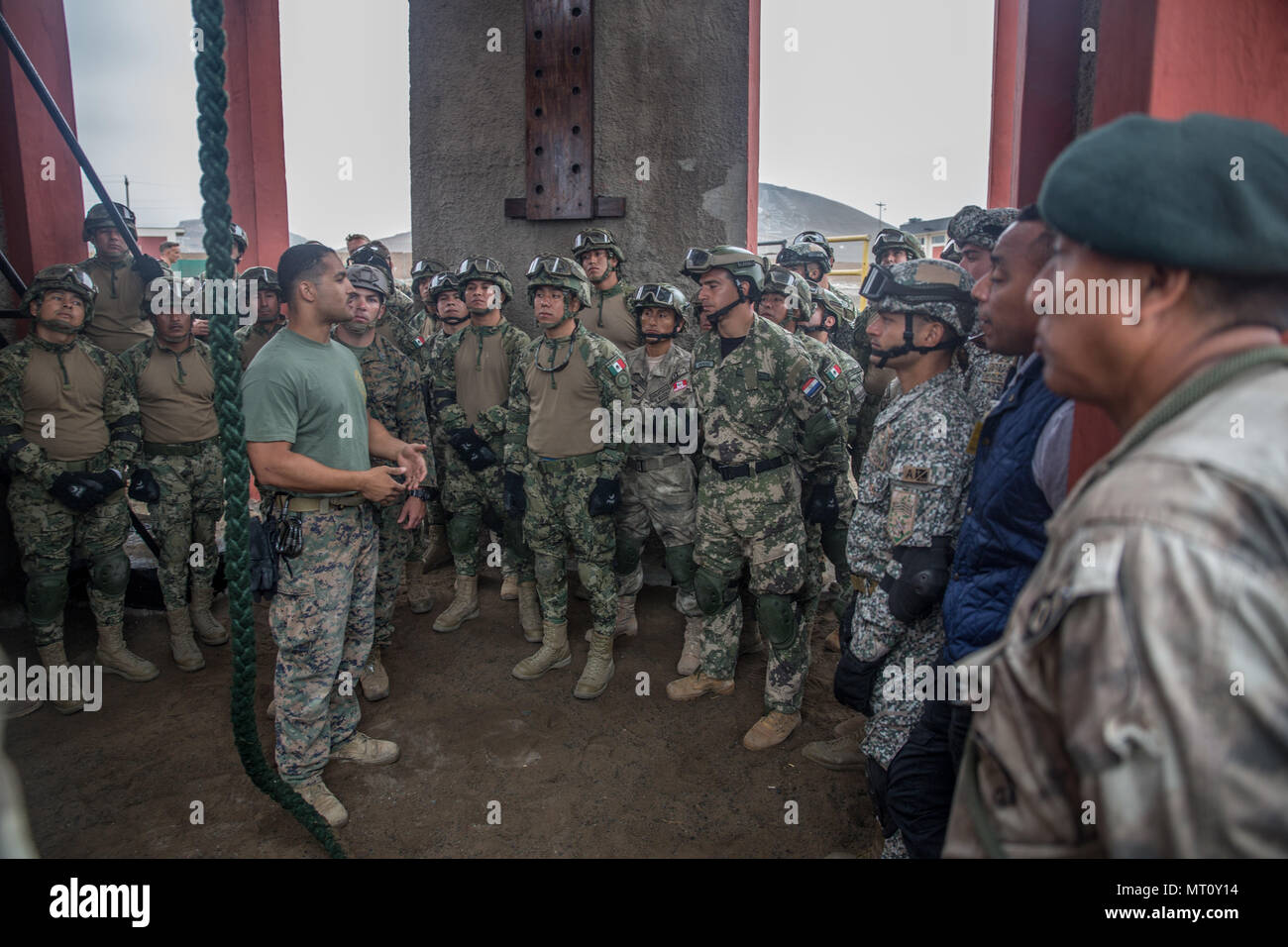 U.S. Marine Staff Sgt. Andrew Rodriguez speaks to a group of ...