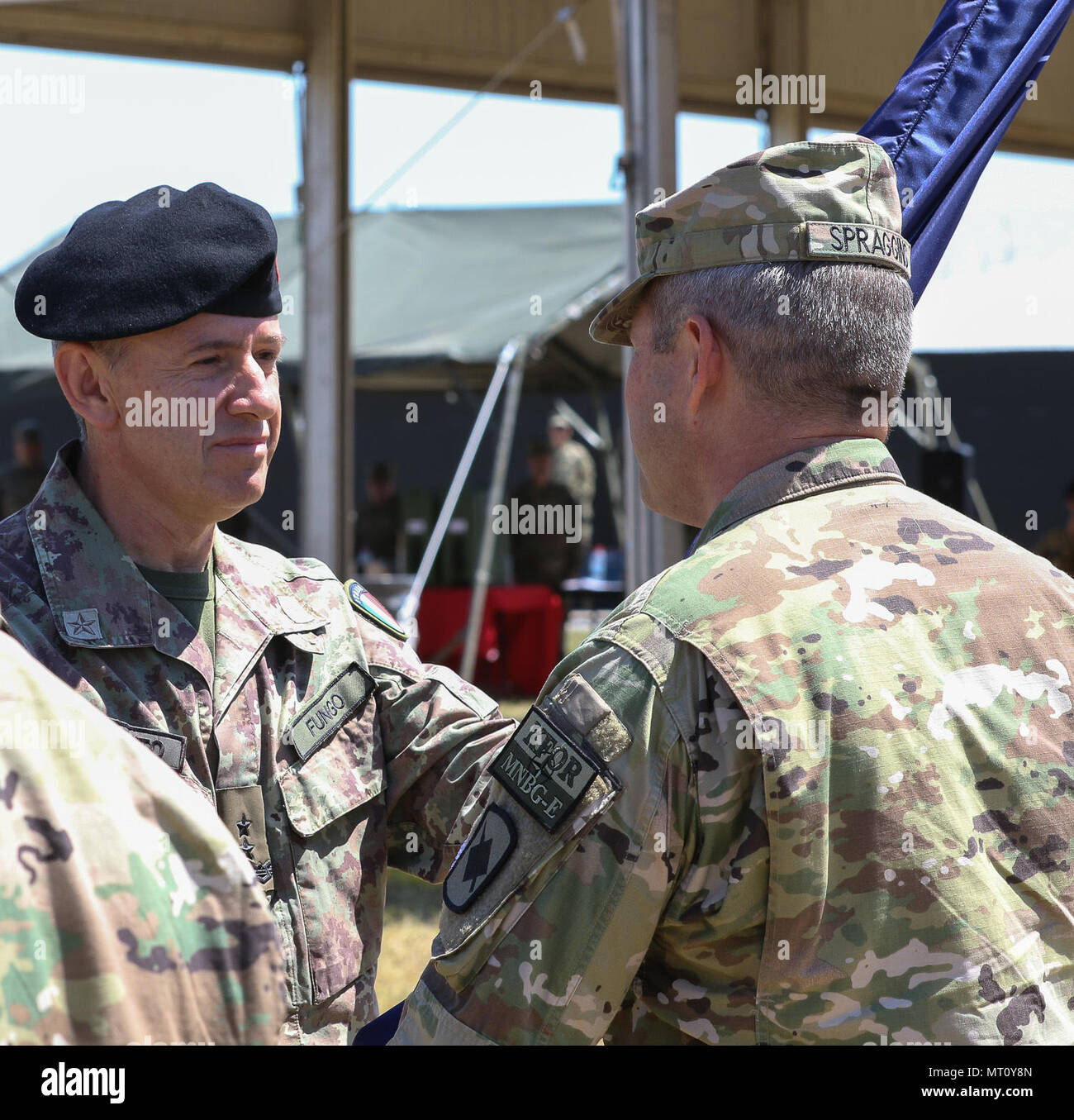 Maj. Gen. Giovanni Fungo, Kosovo Forces commander, hands the NATO flag ...