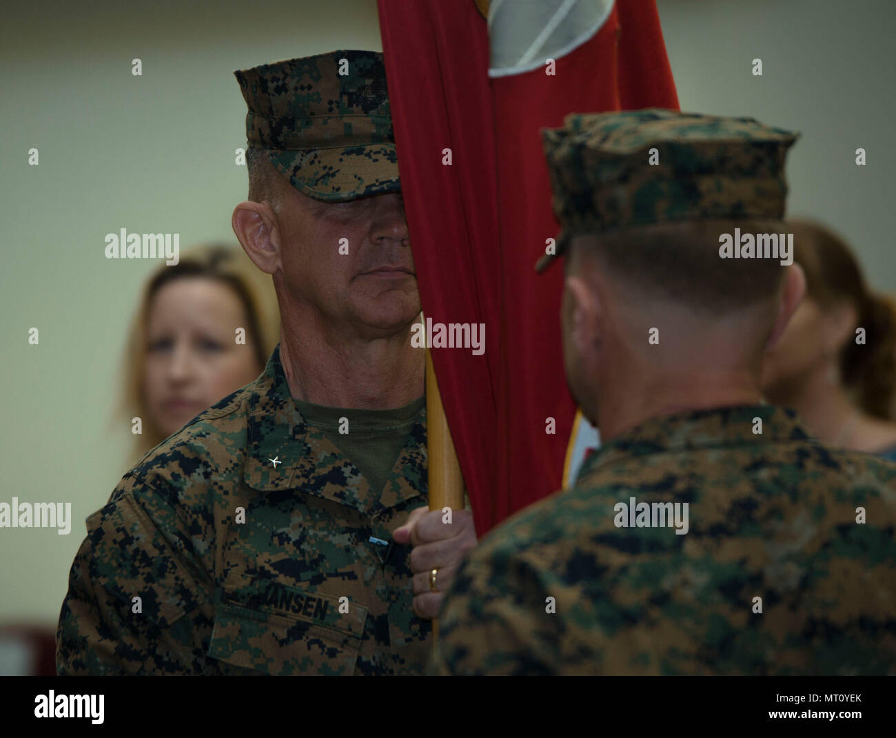 Brig. Gen. John M. Jansen passes the unit colors to Brig. Gen. Chris A ...