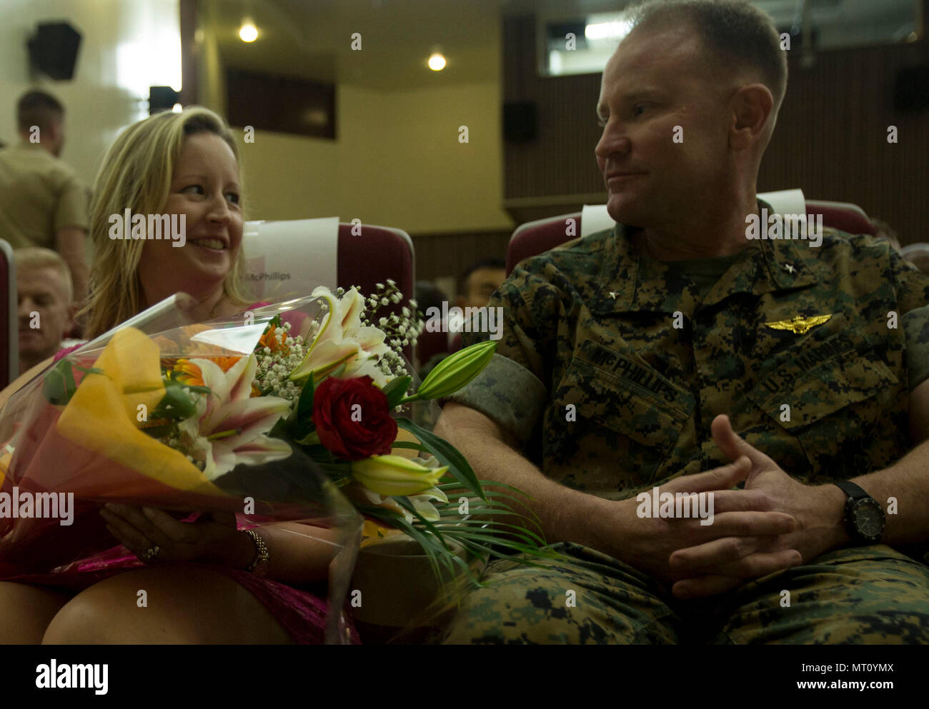 Brig. Gen. Chris A. McPhillips and his wife listen as Lt. Gen. Lawrence ...