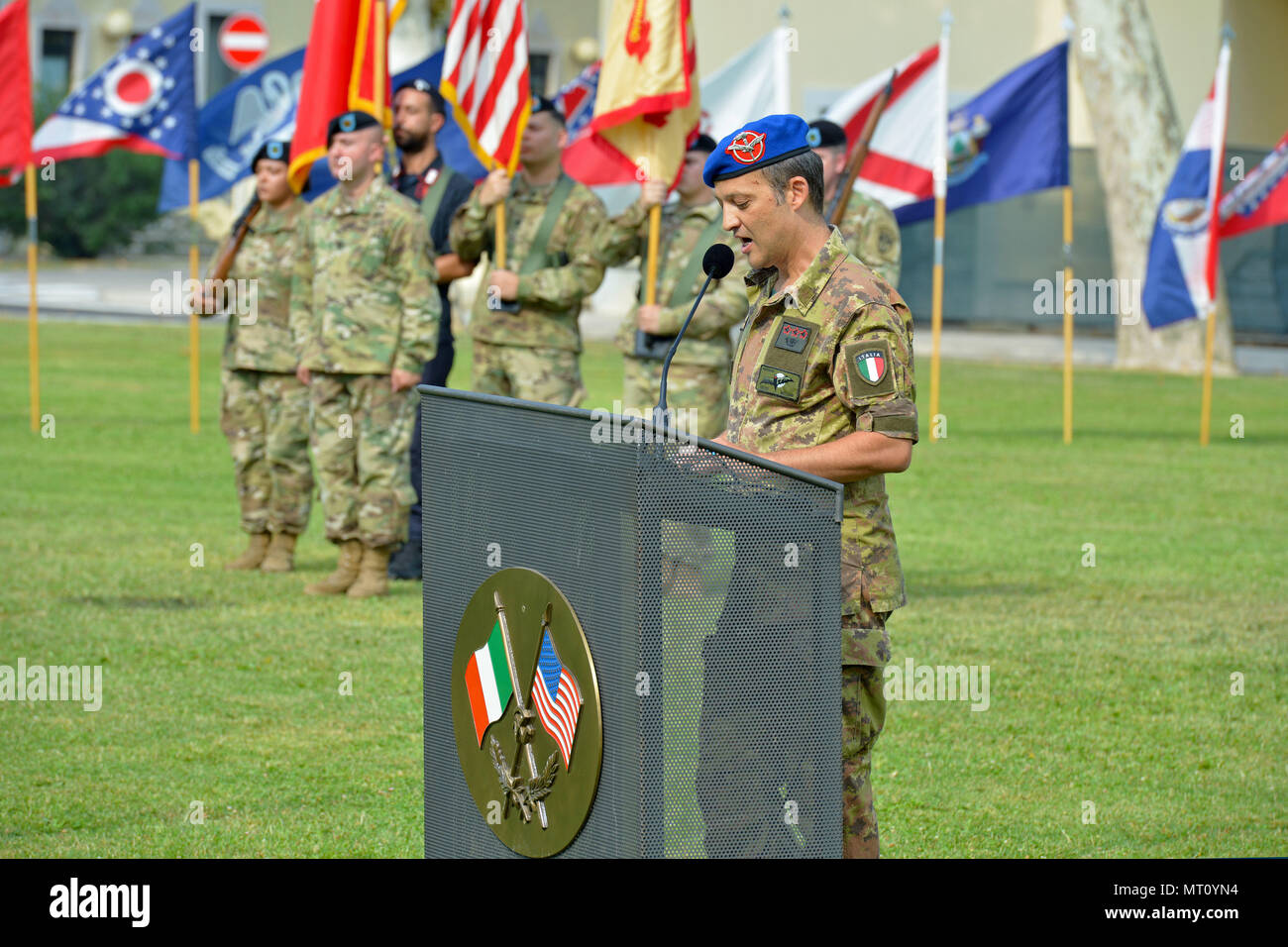 Col. Eric M. Berdy passes the colors to Command Sgt. Maj. Mason L ...