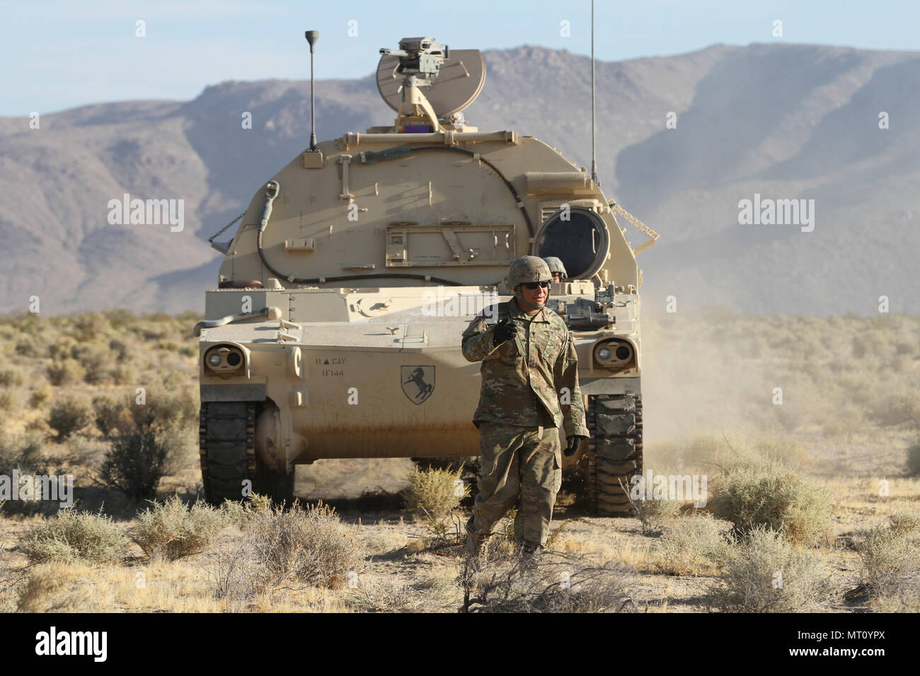 Spc. Alejandro Mendoza of Charlie Battery, 1st Battalion, 144th Field ...