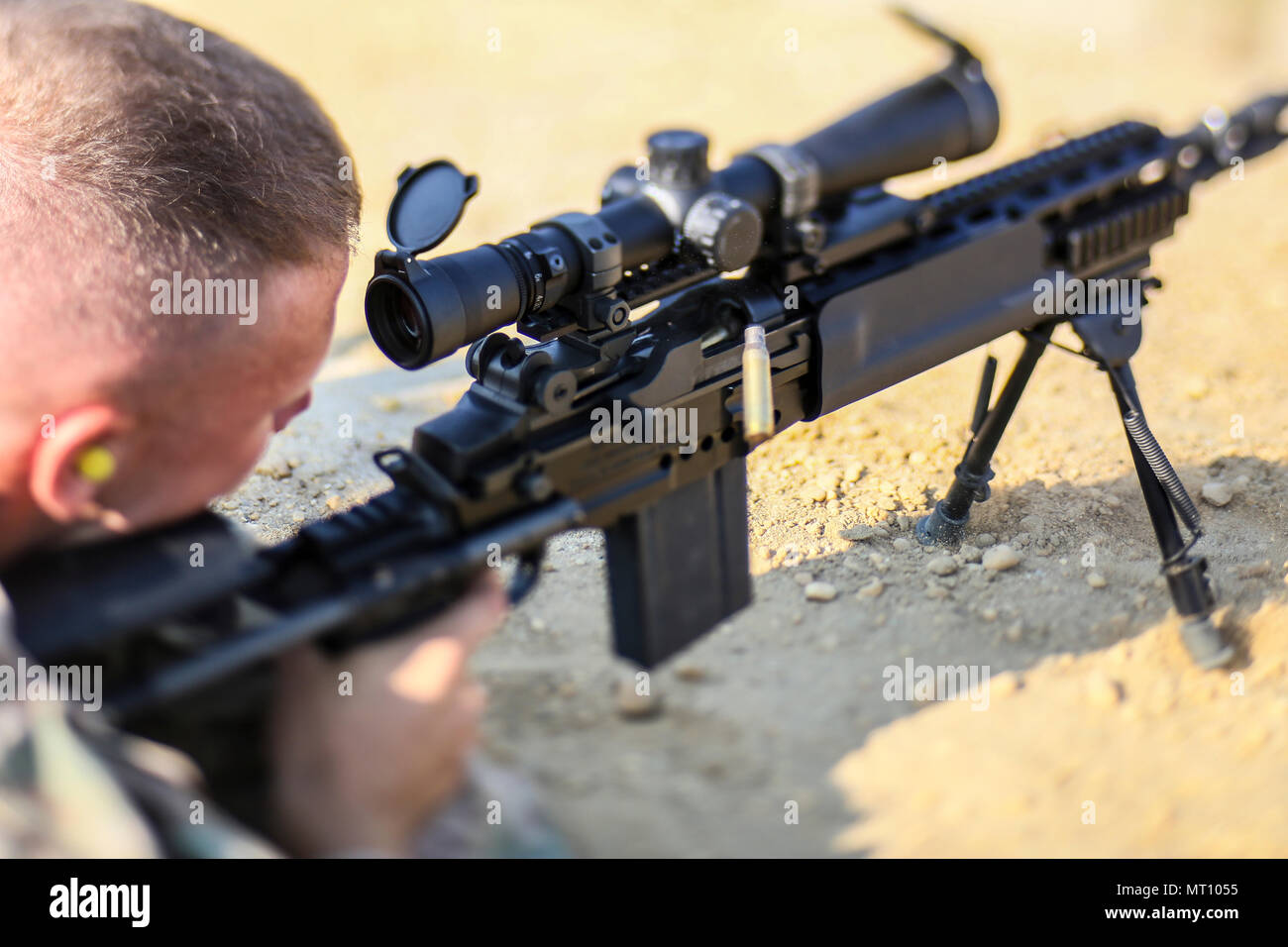 U.S. Army Specialist David Betz fires the Mk 14 Enhanced Battle Rifle during the Squad ...