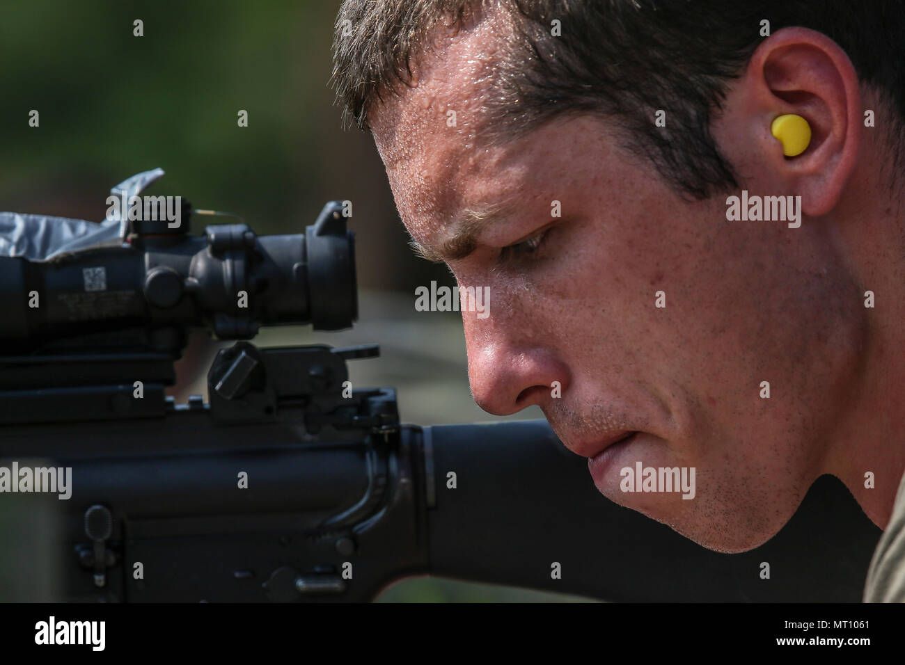 A U.S. Army Soldier focuses before firing an M16A4 rifle during the ...