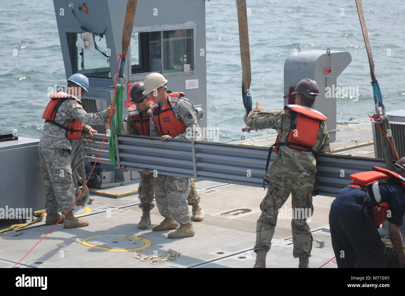 Soldiers of the 331st Transportation Company (Causeway) assemble a ...
