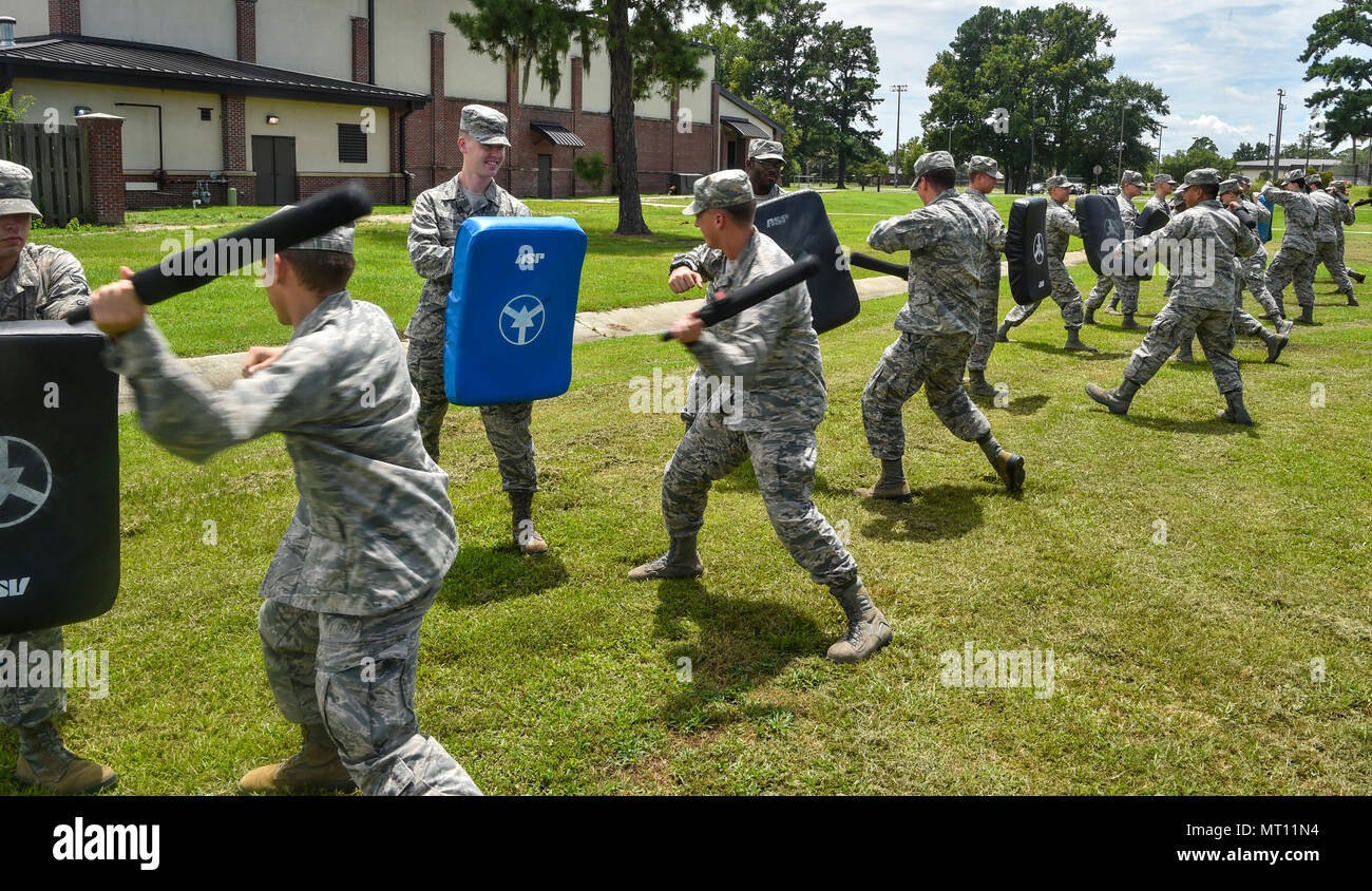 Airmen practice with less-than-lethal weapons during an augmentee ...