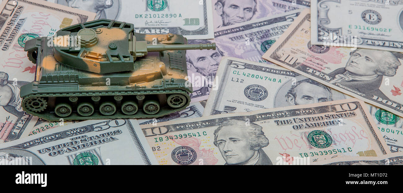 tank against the background of dollars. Concept of war Stock Photo - Alamy