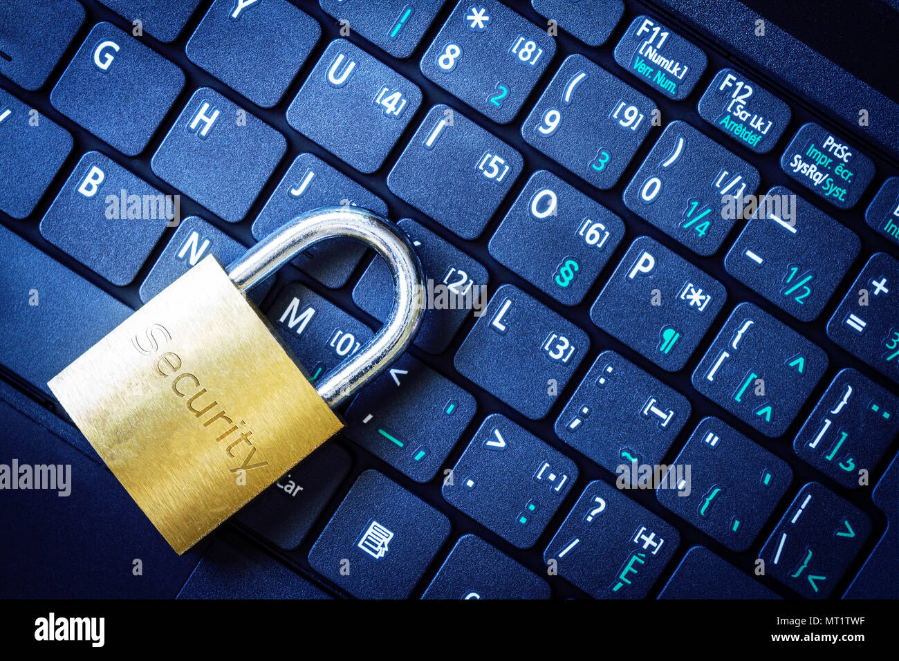 Golden Padlock On Computer Laptop Keyboard With Security Word Engraved