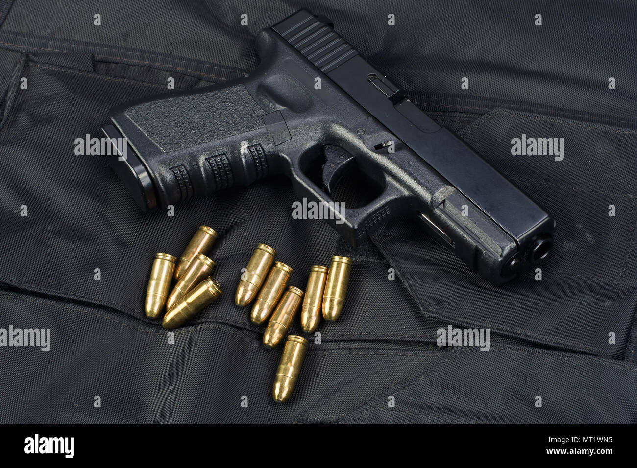 Police weapon and equipment on black uniform background Stock Photo - Alamy