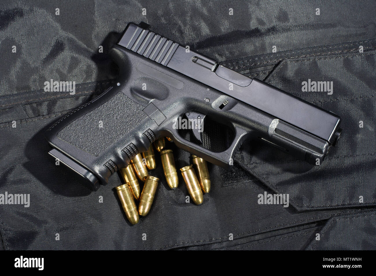Police weapon and equipment on black uniform background Stock Photo - Alamy