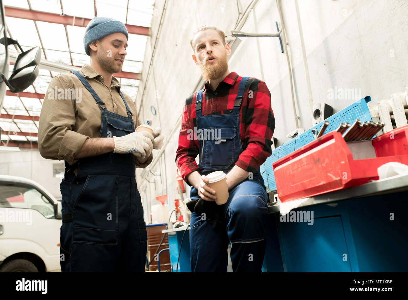 Auto Mechanics Chatting On Break Stock Photo - Alamy