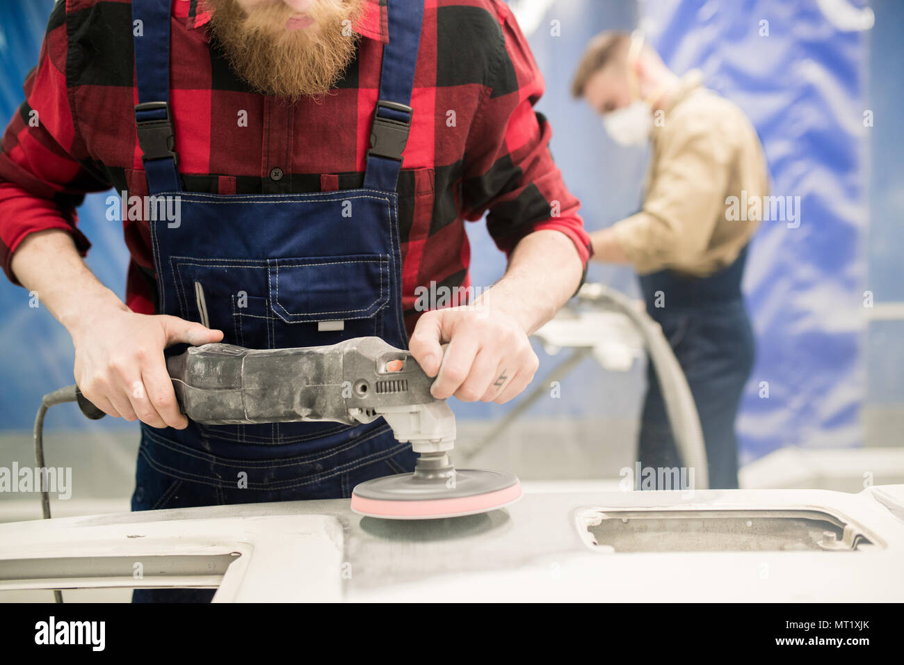 Repairmen Polishing Auto Parts Stock Photo - Alamy