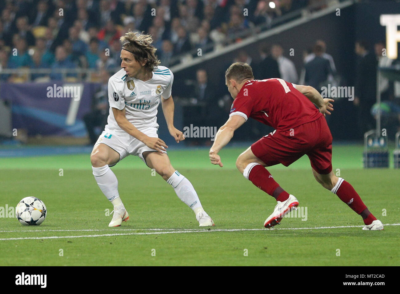 Luka Modric of Real Madrid and James Milner of Liverpool during the ...