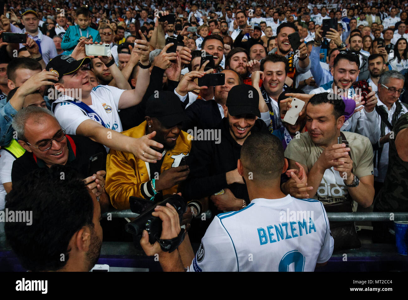 Karim Benzema of Real Madrid celebrates with fans after the UEFA ...
