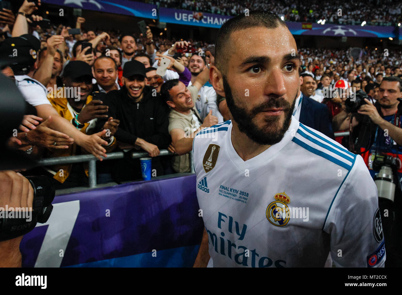 Karim Benzema of Real Madrid celebrates with fans after the UEFA ...