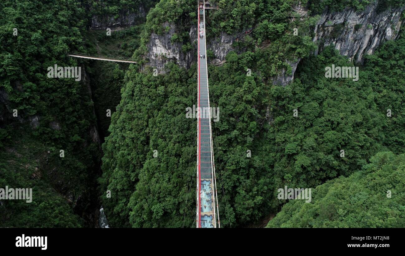 Enshi, China's Hubei Province. 27th May, 2018. People walk on glass ...
