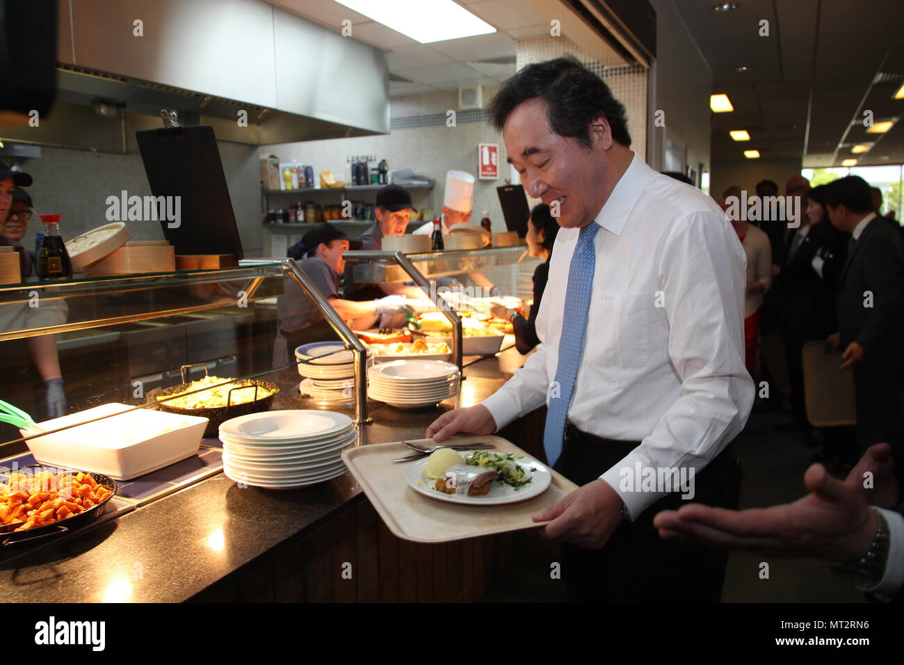 PM Lee at SK Biotek Ireland Prime Minister Lee Nak-yon carries a food ...