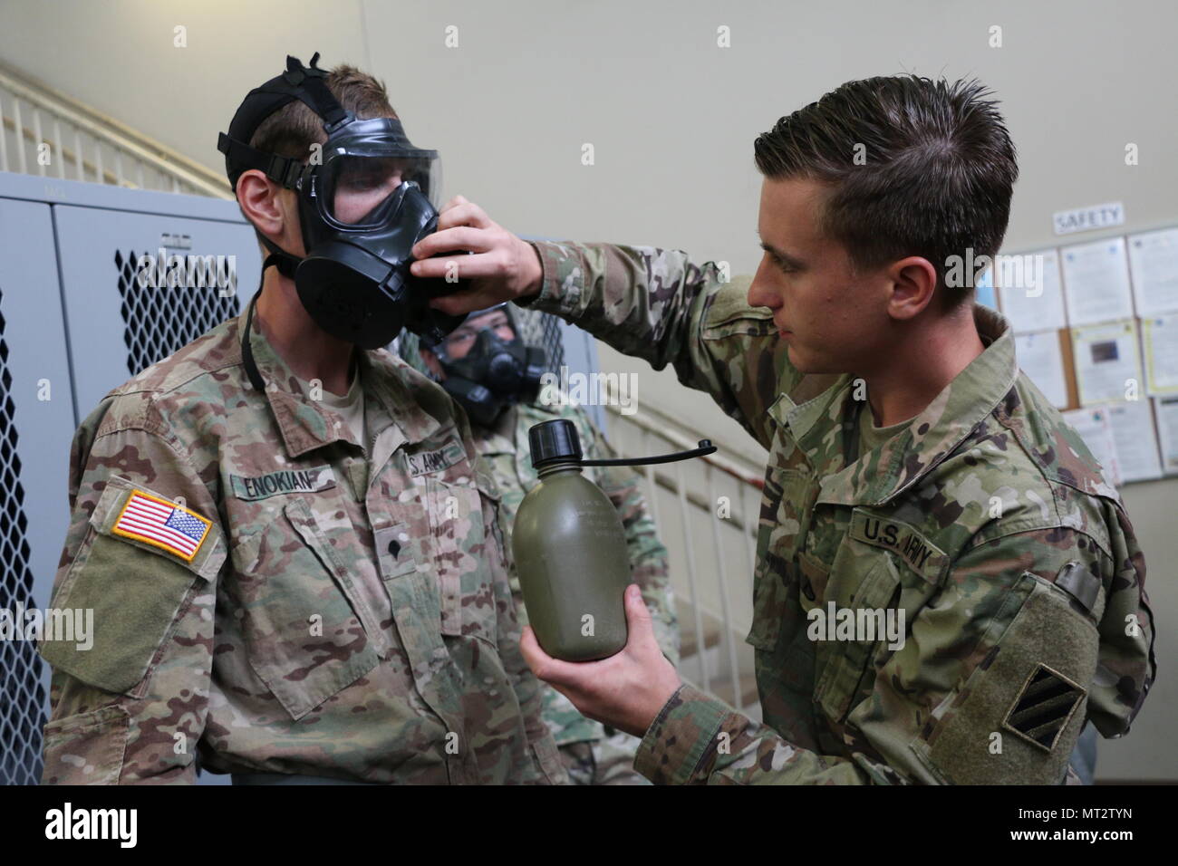 Spc. Brandon Walker (right), a chemical, biological, radiological and ...